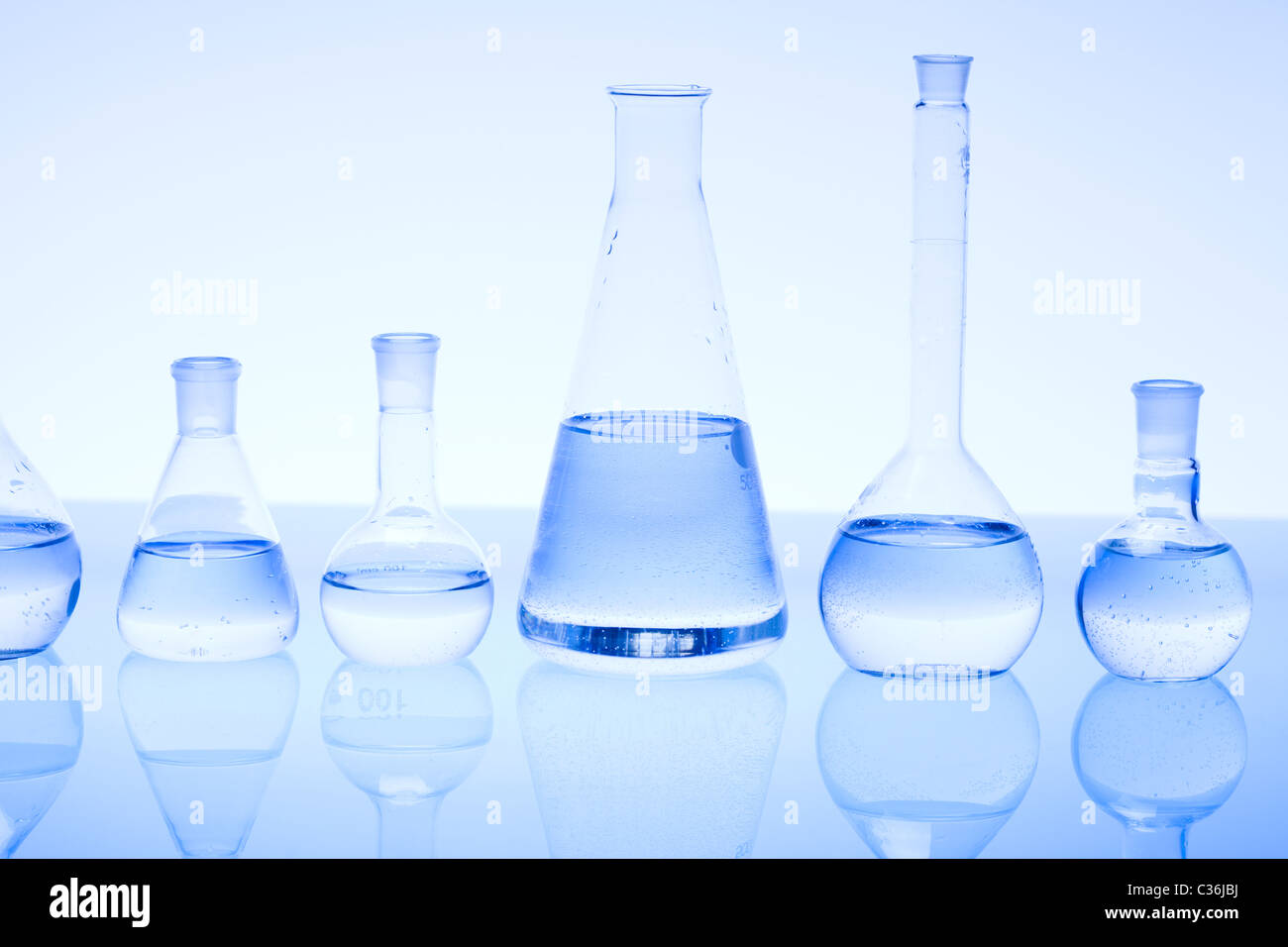 Laboratory glass in blue scenery Stock Photo - Alamy