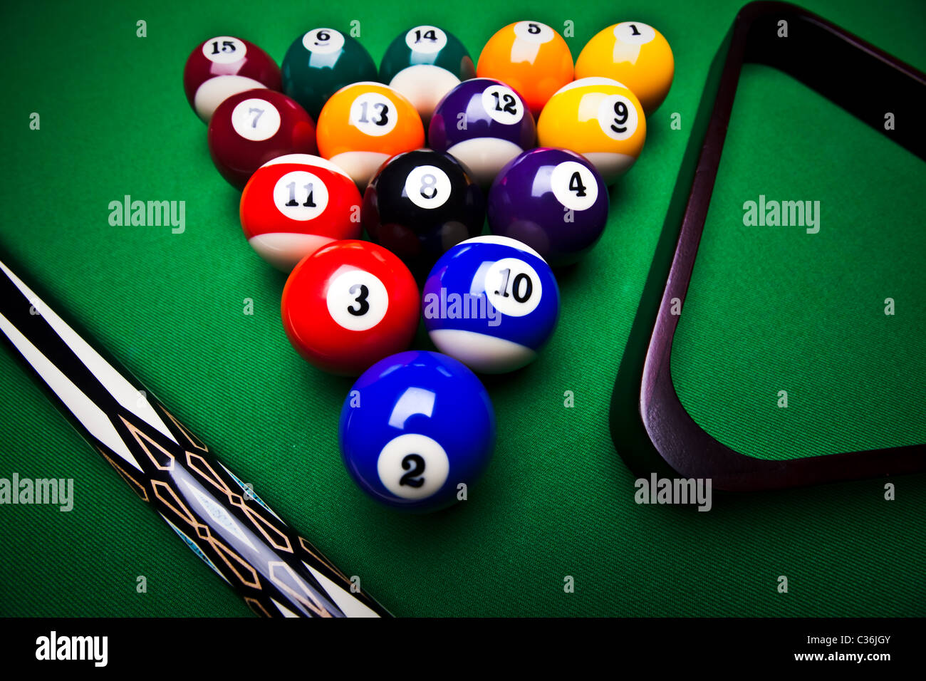 Billiard balls over green table Stock Photo - Alamy