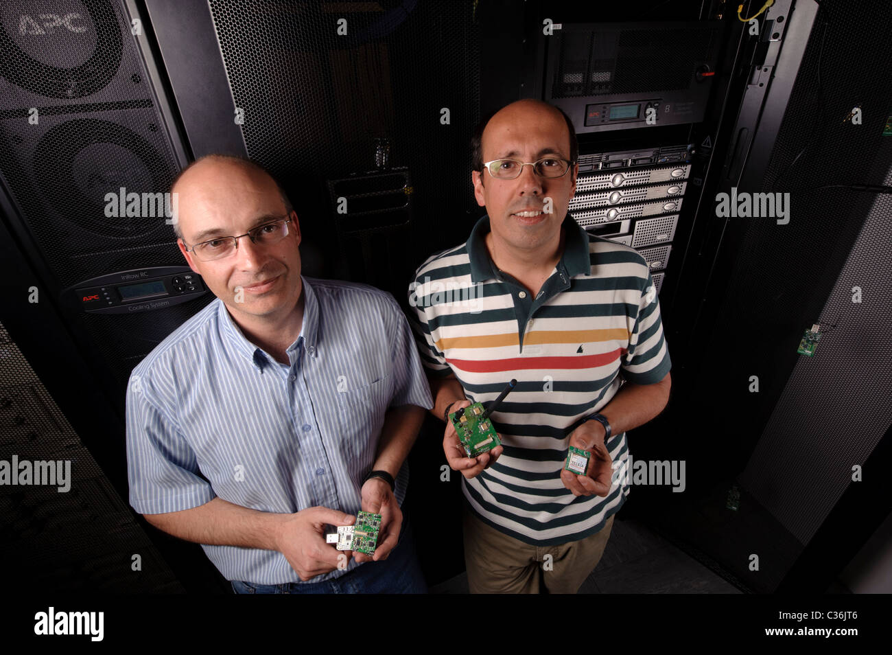 Technicians in server room Stock Photo - Alamy