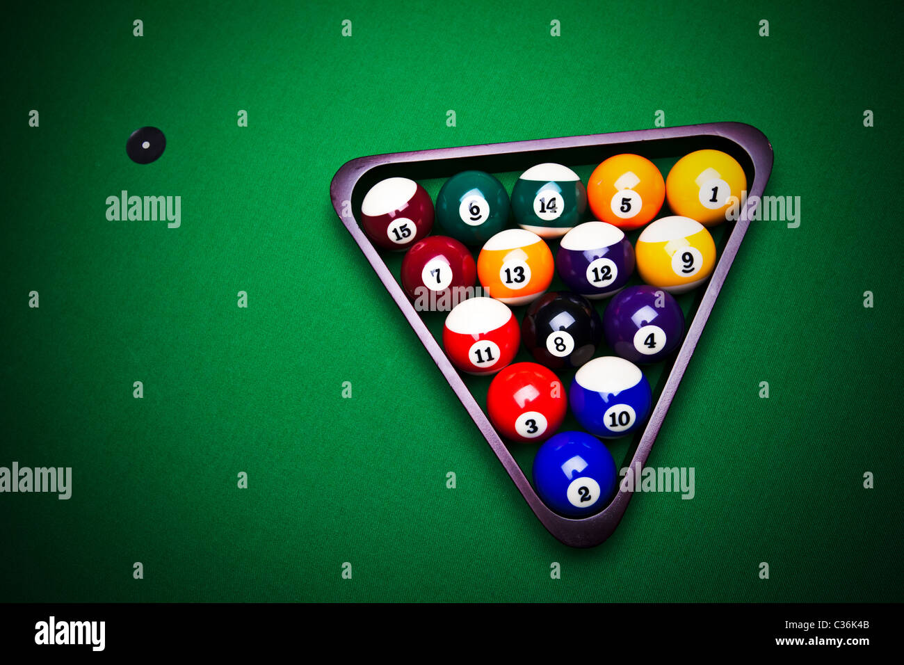 Billiard balls over green table Stock Photo - Alamy