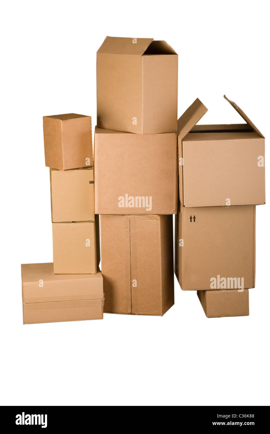Brown different cardboard boxes arranged in stack on white background ...