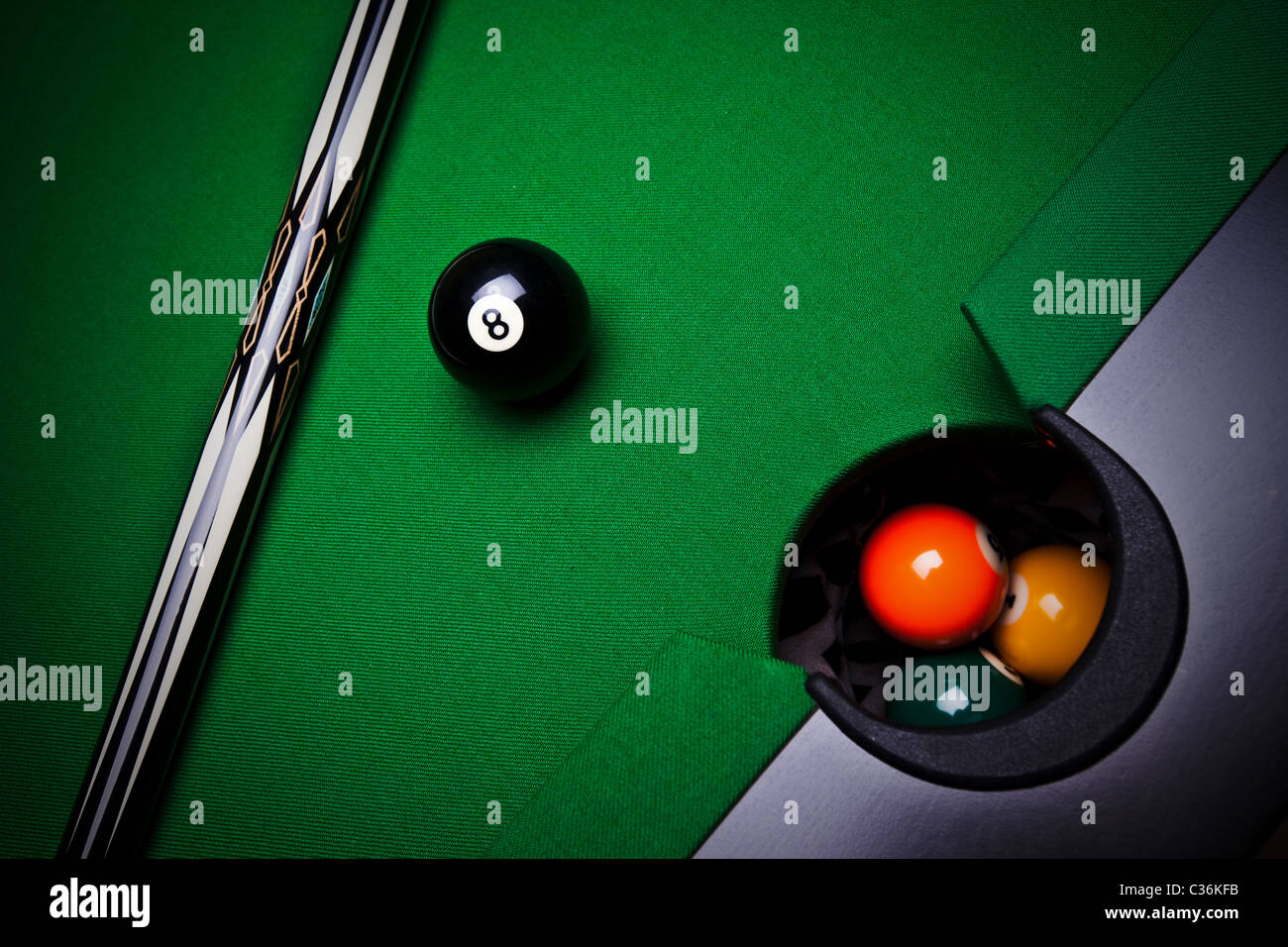 Billiard balls over green table Stock Photo - Alamy