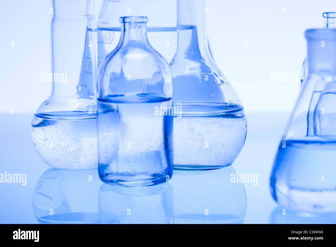 Laboratory glass in blue scenery Stock Photo - Alamy