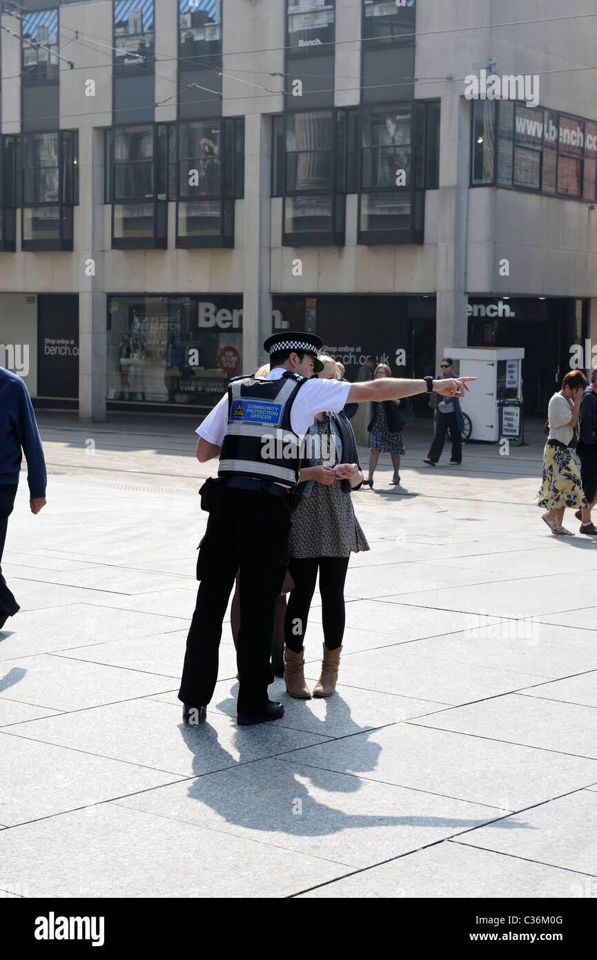 Stock photo of a community protection officer helping people find their ...