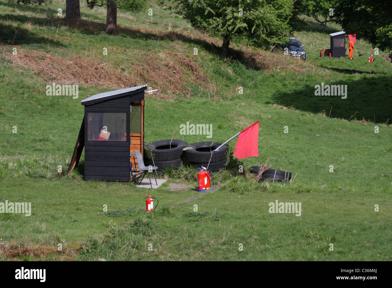 A track marshal post showing a red flag and safety equipment at Loton ...