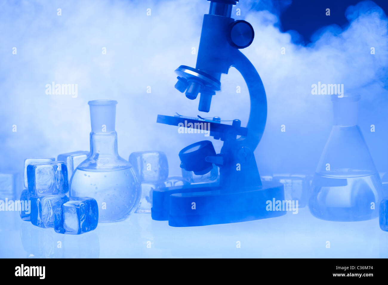 Laboratory glass in blue scenery Stock Photo - Alamy