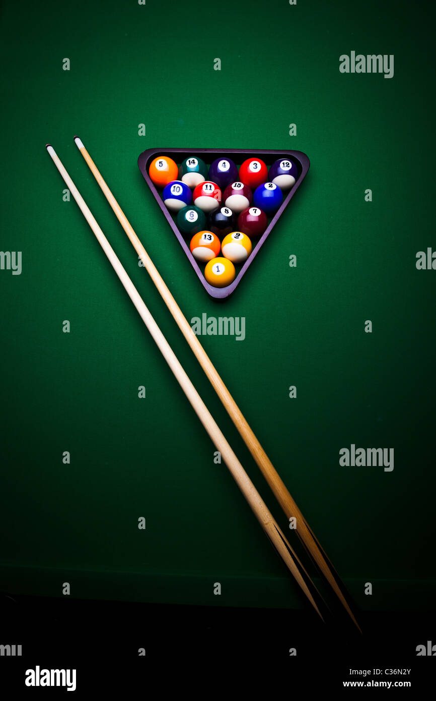 Billiard balls over green table Stock Photo - Alamy