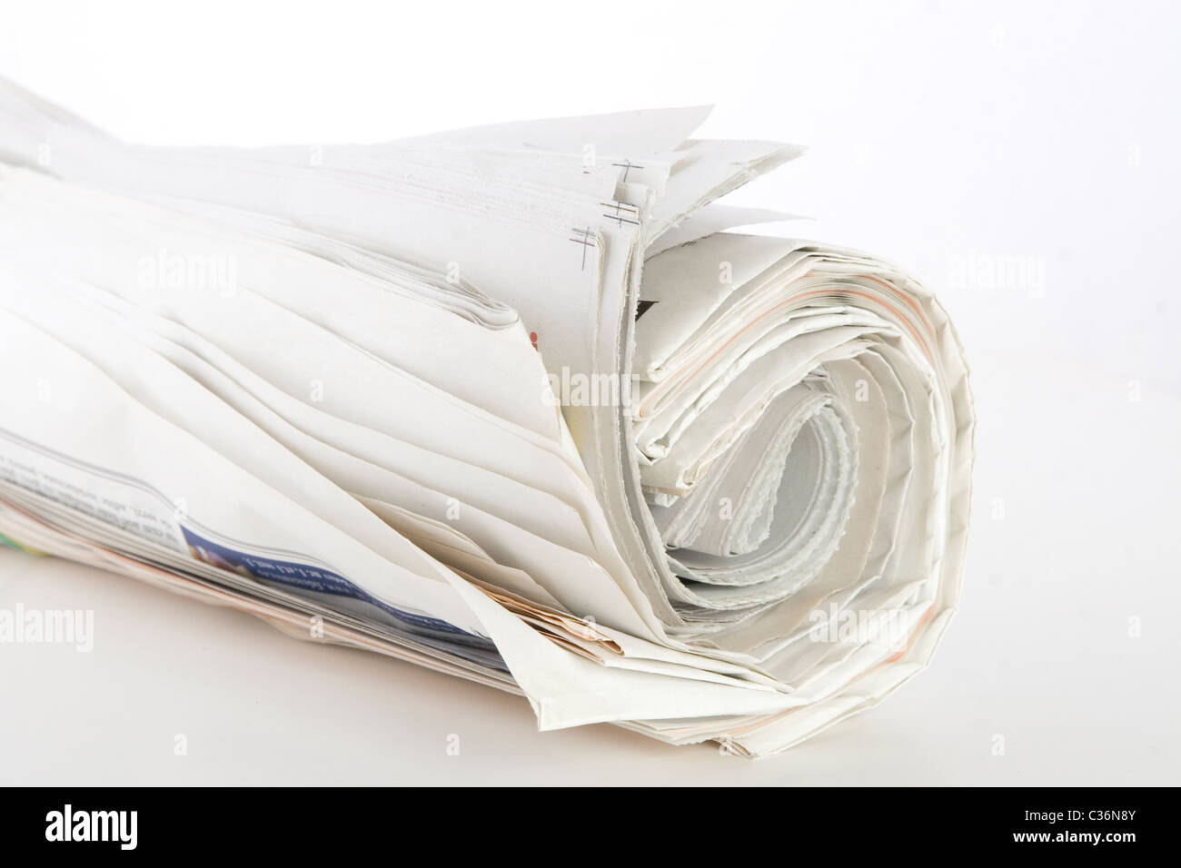 Roll of newspapers, isolated on white background Stock Photo - Alamy