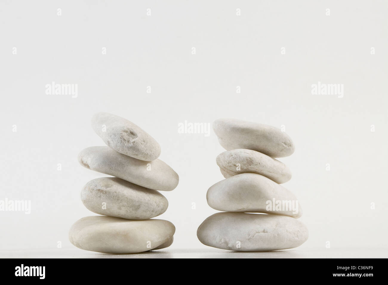 two tower of white stones, harmony concepts Stock Photo - Alamy