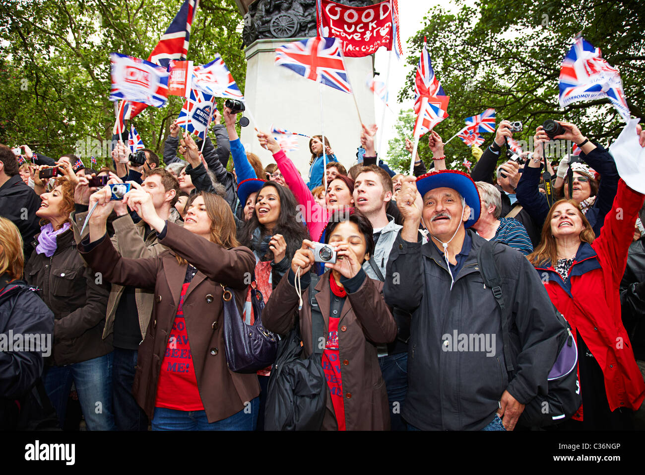 A crowd go wild and celebrate as the royal wedding passes by Stock ...