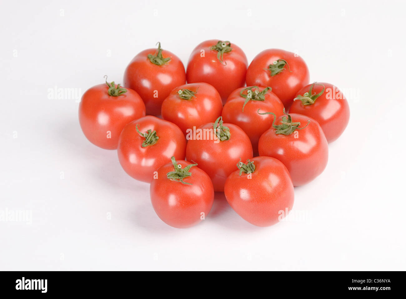 fresh red tomatoes ready for salad, on white background Stock Photo - Alamy