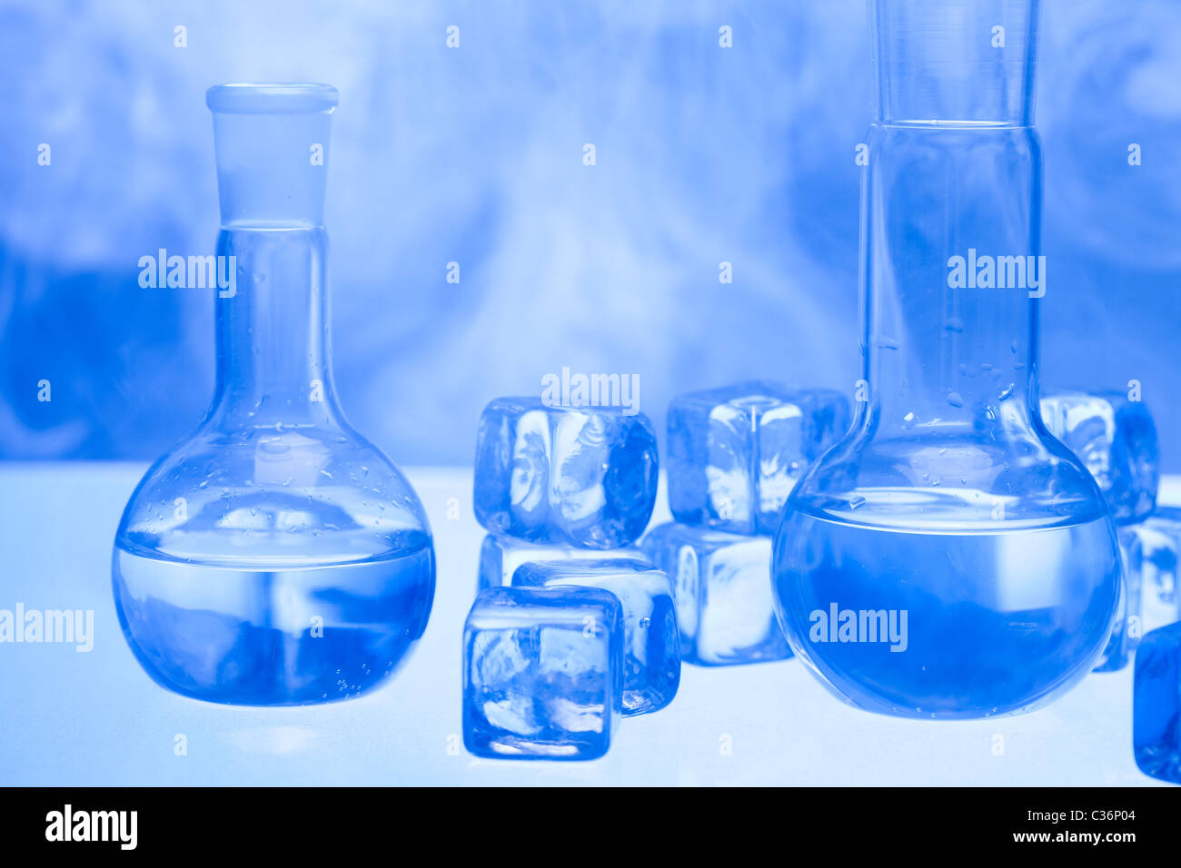 Laboratory glass in blue scenery Stock Photo - Alamy