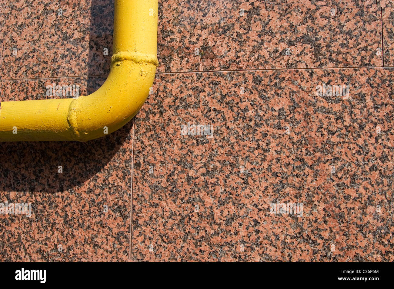 front view of yellow pipe on marble background Stock Photo - Alamy