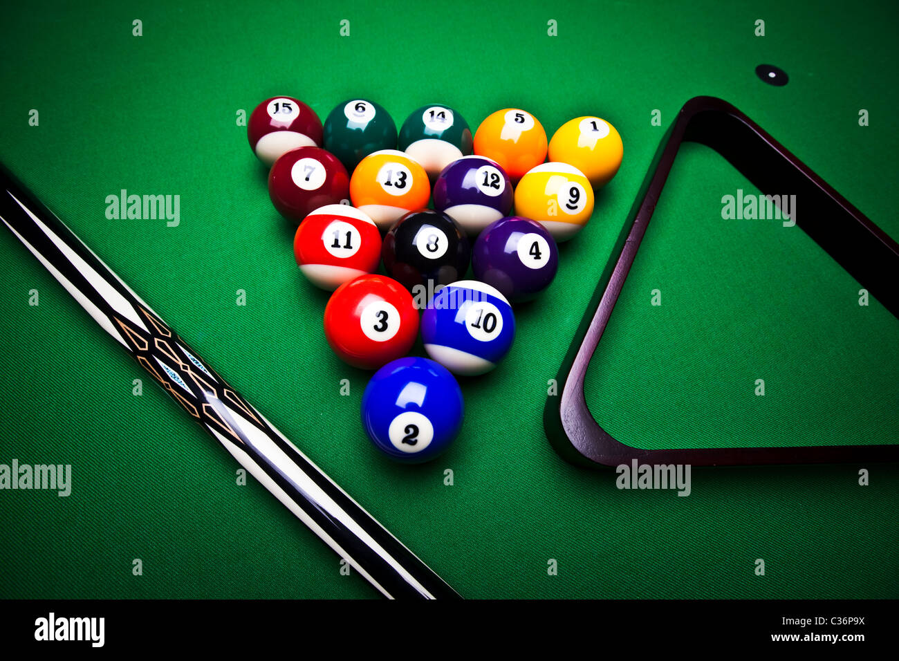 Billiard balls over green table Stock Photo - Alamy