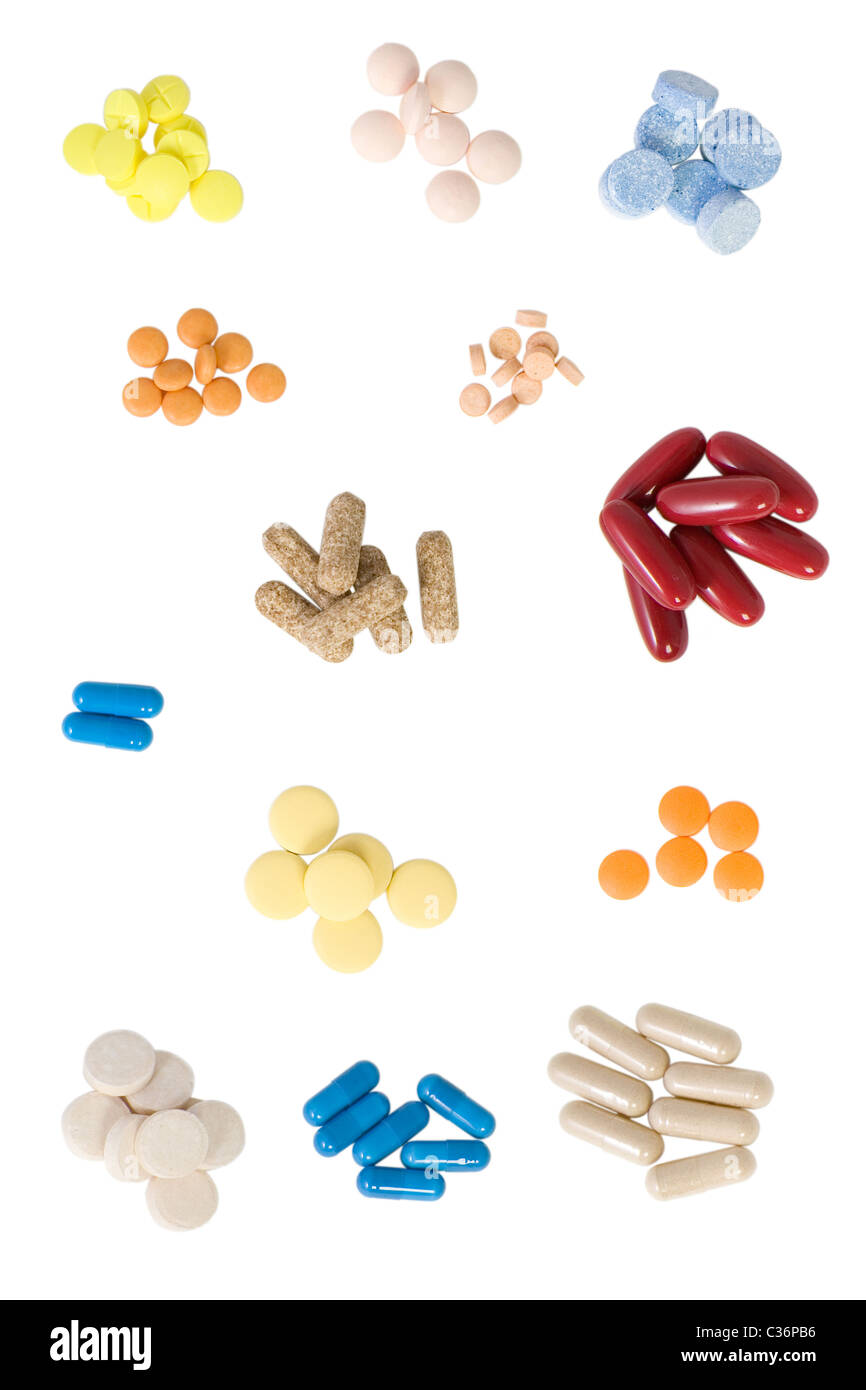 different shape and colors pills on white background Stock Photo - Alamy