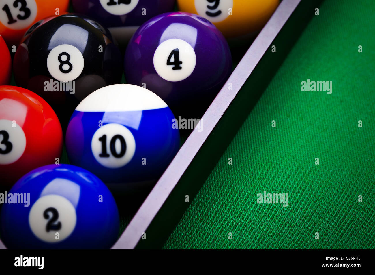 Billiard balls over green table Stock Photo - Alamy