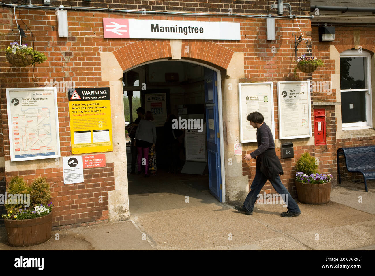 Person entering Manningtree railway station Essex England Stock Photo ...