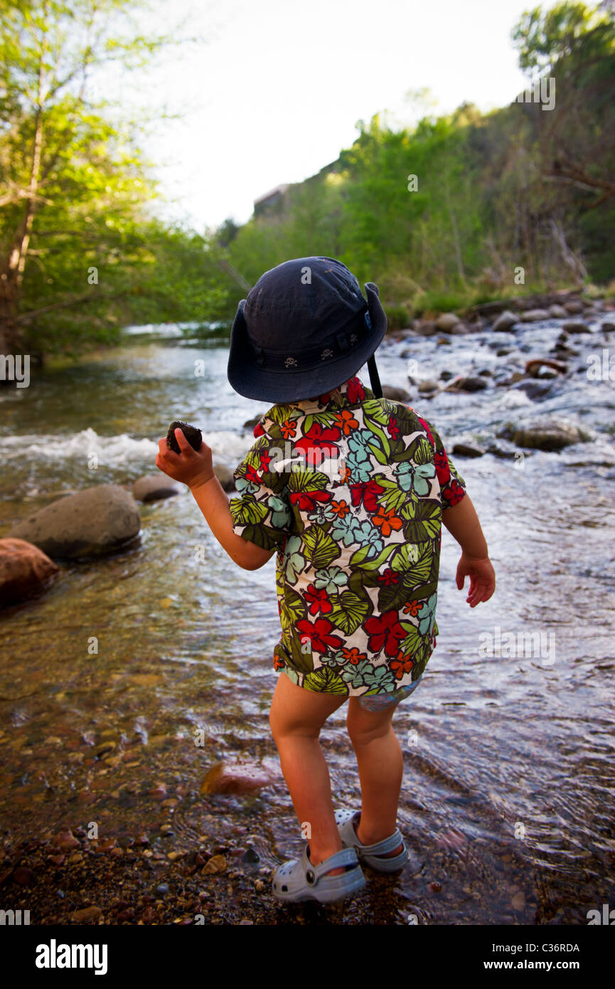 Young children throwing stones hi-res stock photography and images - Alamy