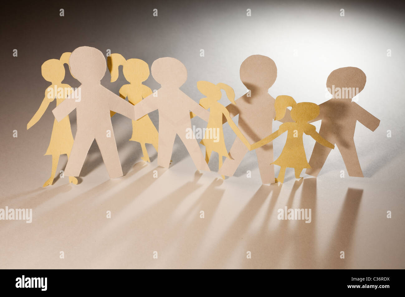 Paper Chain girls and boys, concept of Teamwork Stock Photo - Alamy
