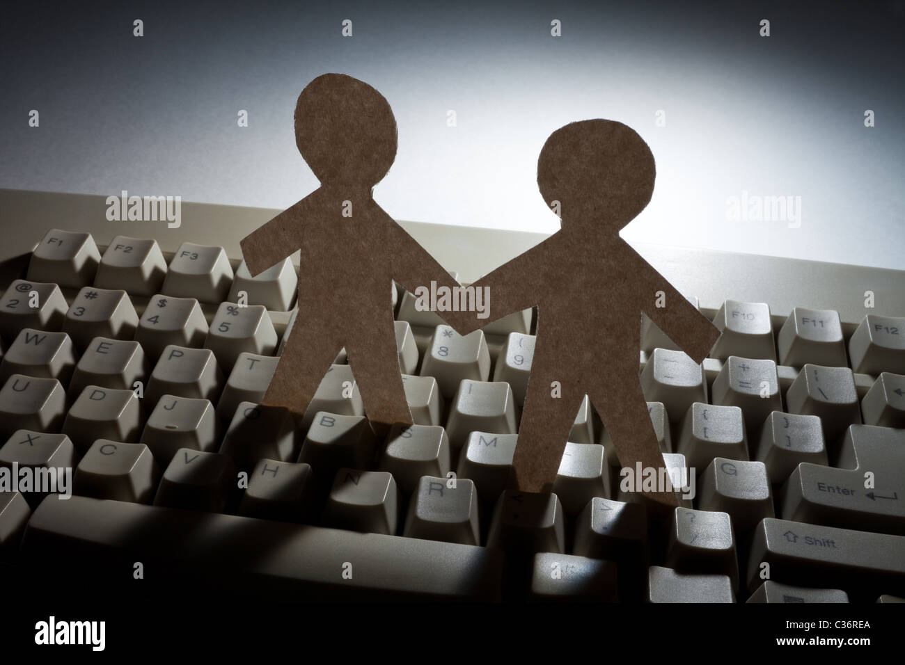 Paper Chain Men, concept of Friendship Stock Photo - Alamy