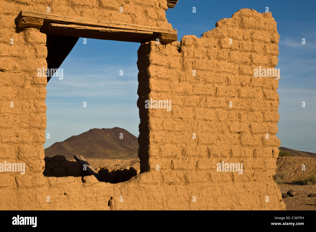 Old adobe structure with a window view of Painted Rock Mountains, near ...