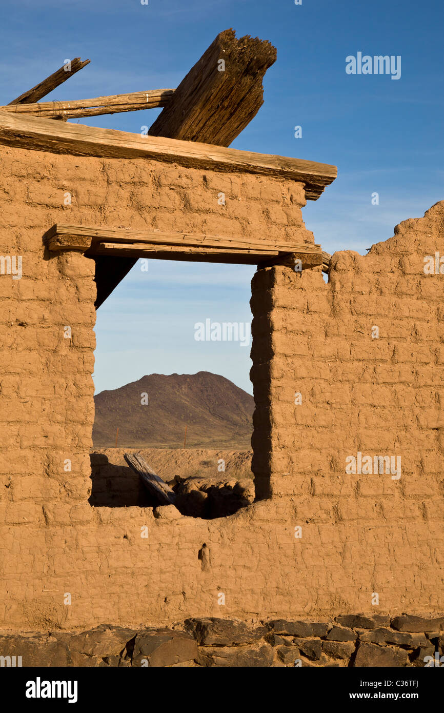 Old adobe structure with a window view of Painted Rock Mountains, near ...