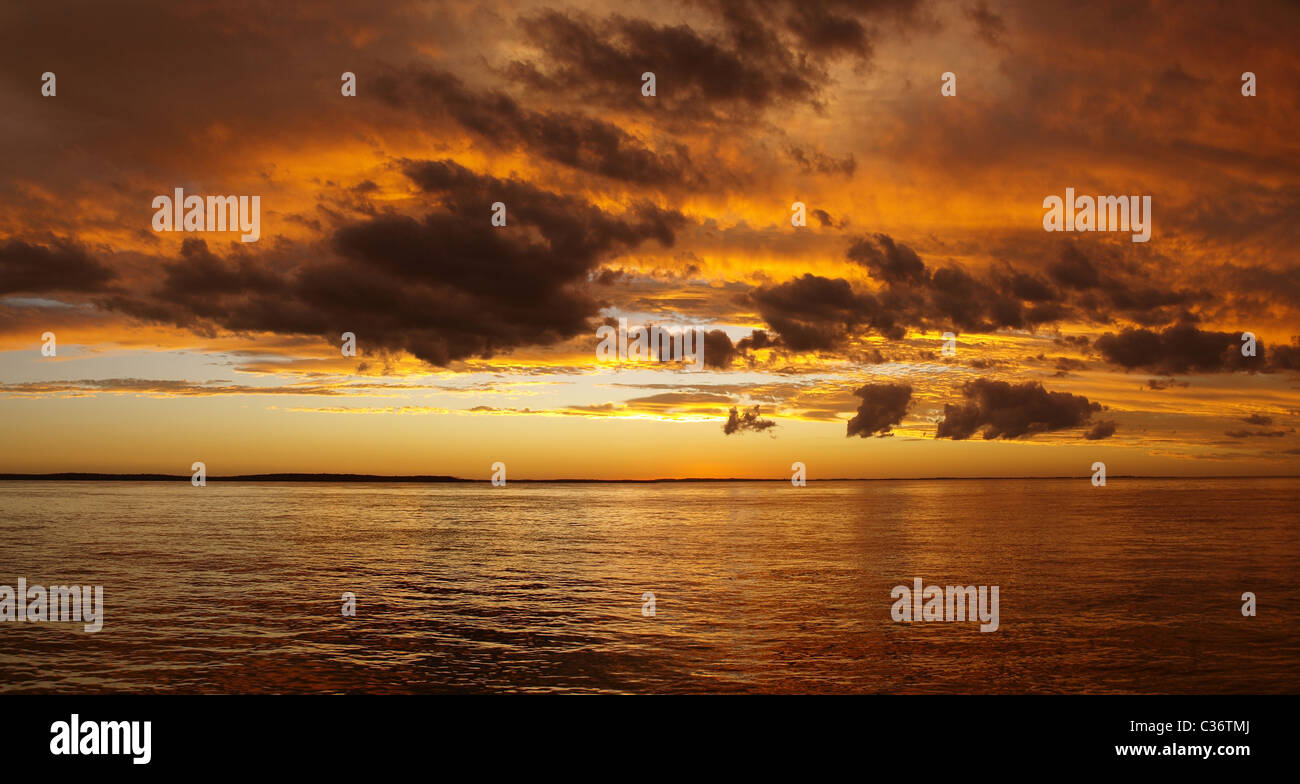Colorful multi colored gold/orange striking cloudy Australian Sunrise ...