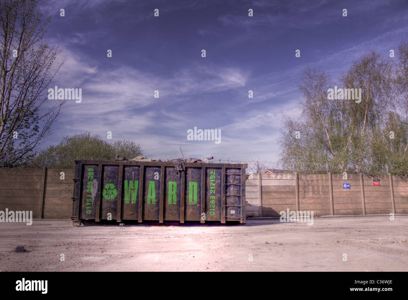 Ward Roll On Roll Off open topped container. Against a blue sky with ...