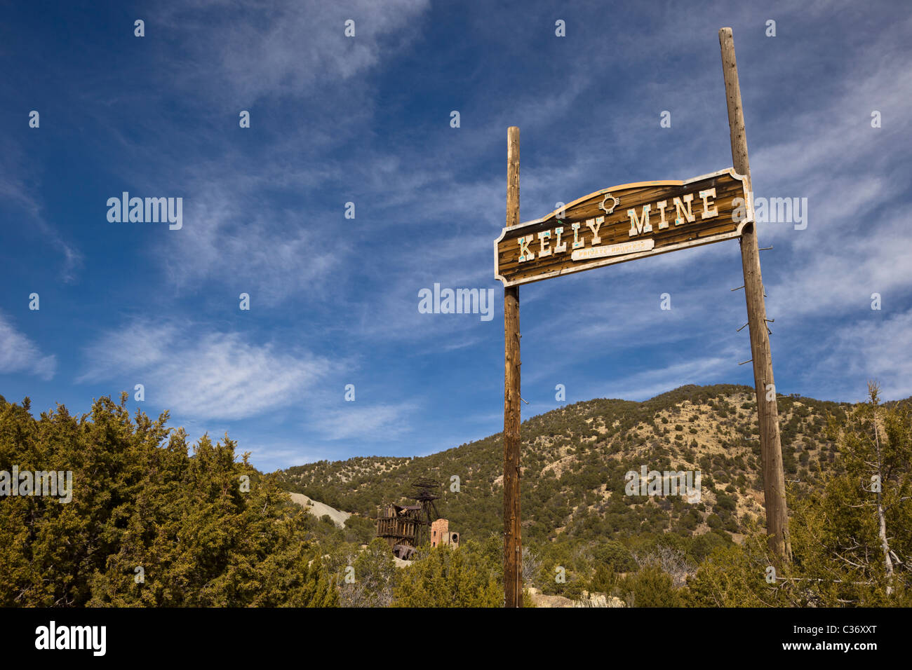 Signpost for the Kelly Mine Ghost Town with the mine headframe and ...