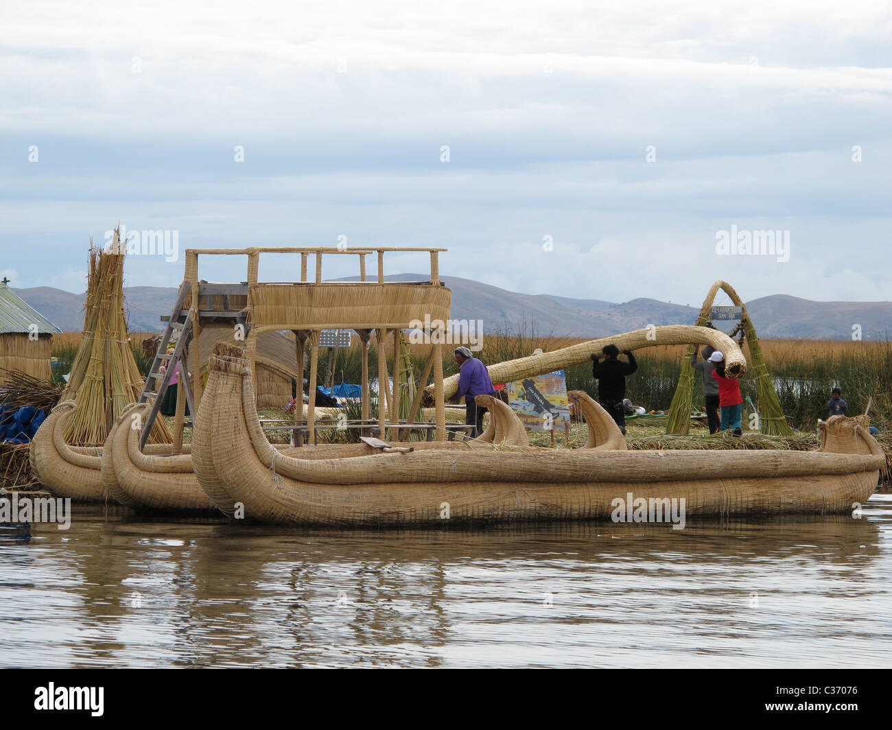 Reed boats building with observation tower, uros, floating island, lake ...