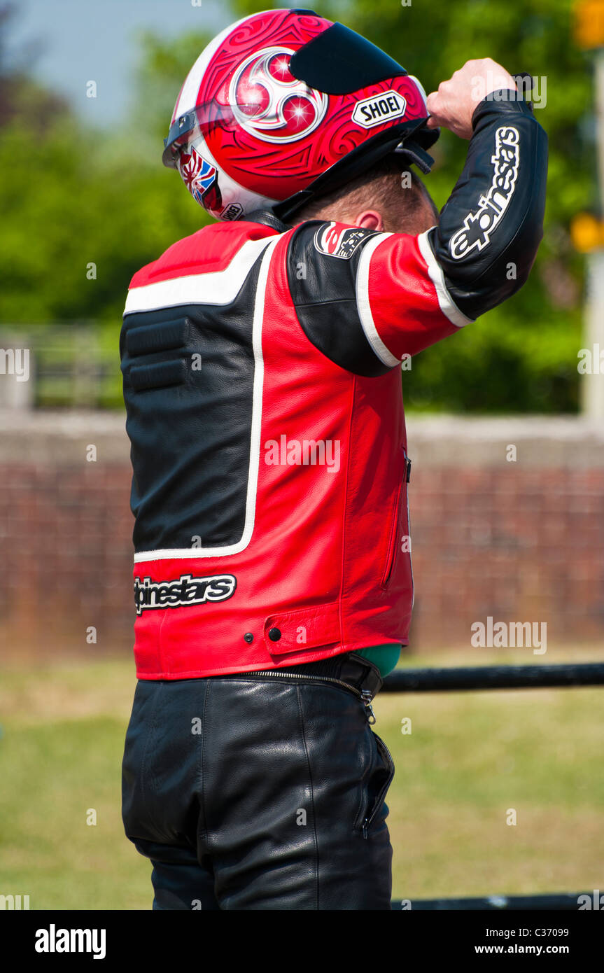Motorcyclist Removing His Crash Helmet Stock Photo - Alamy