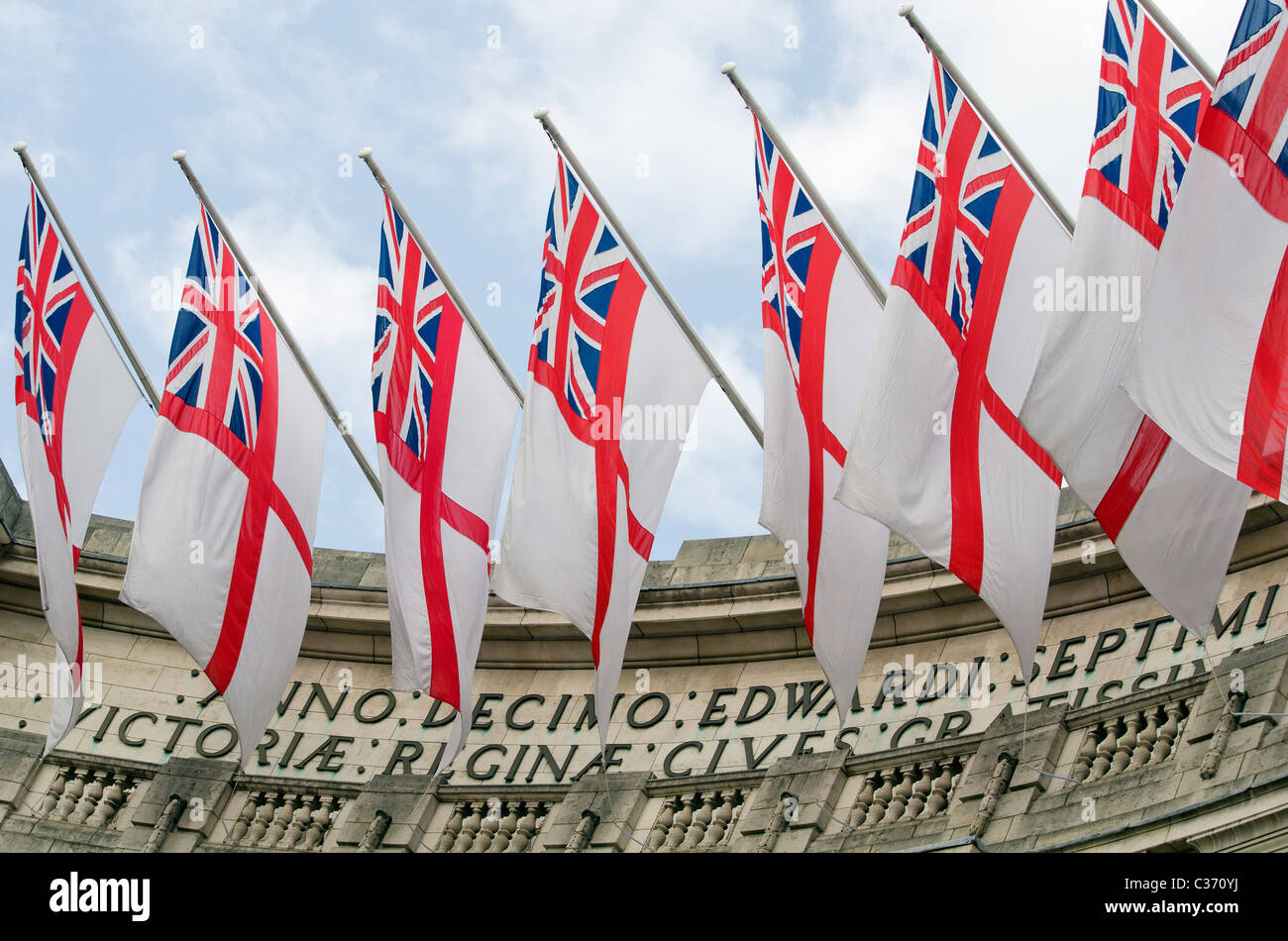 Union Jack flags flapping in the Admiralty Arch on the Mall, London, UK ...