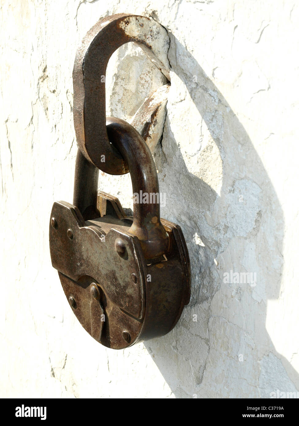 Old locks on a white background of an old wall Stock Photo - Alamy