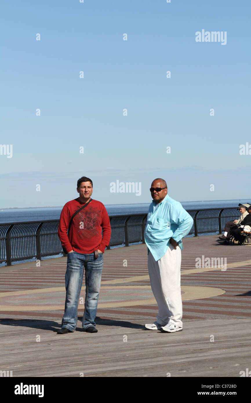Two Men chatting at the beach board Stock Photo - Alamy