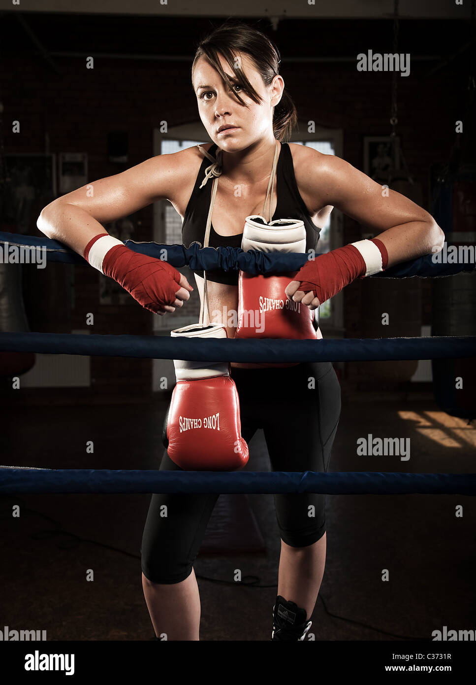 Female boxer posing at edge of ring Stock Photo - Alamy