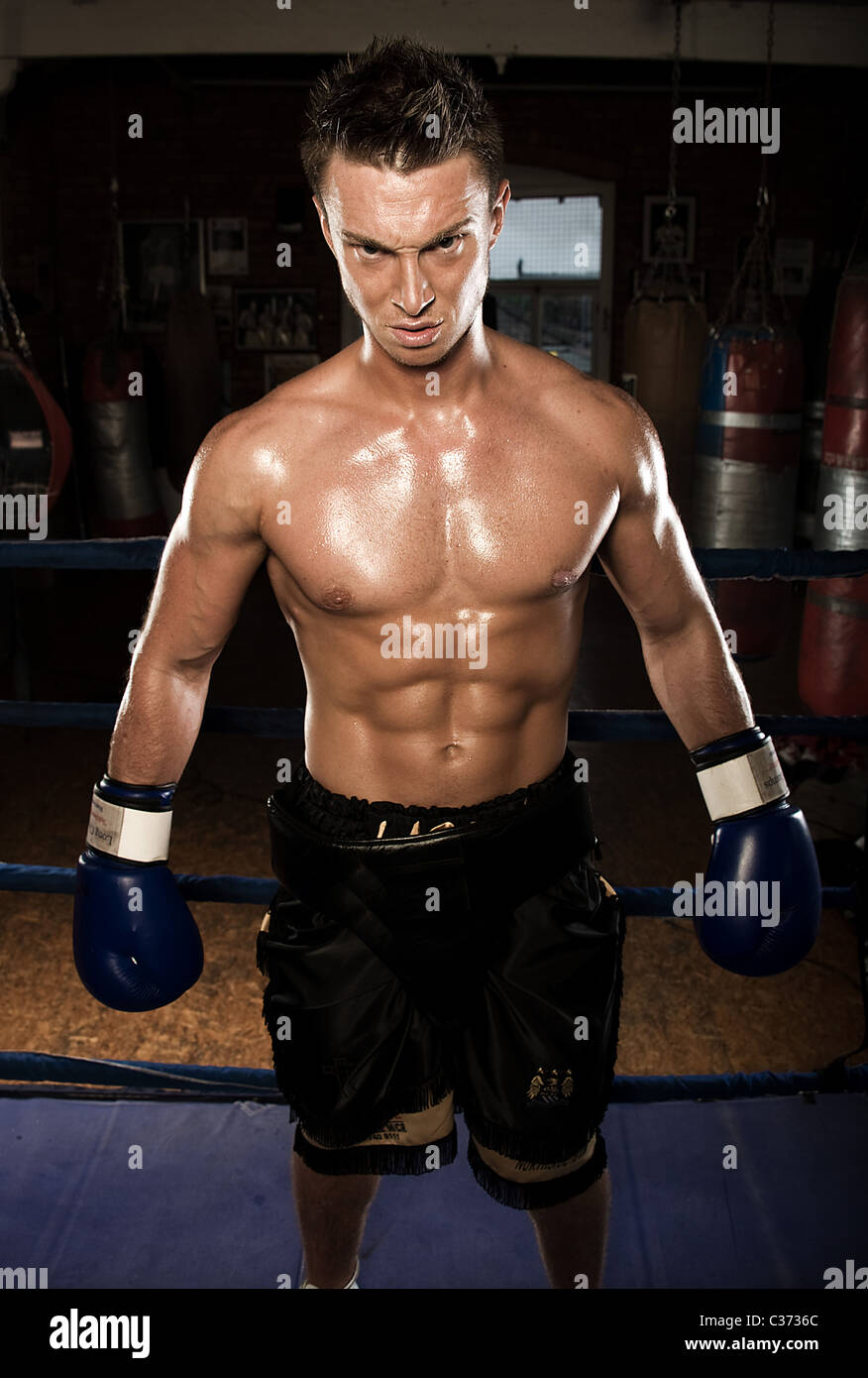 Portrait of male boxer looking aggressive Stock Photo - Alamy
