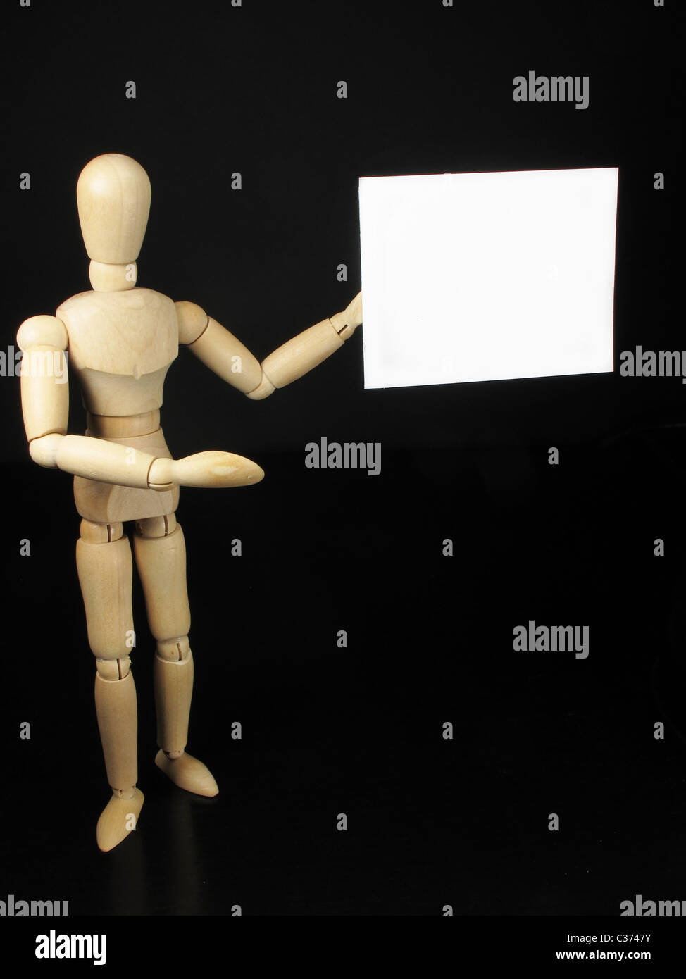 a humanoid doll with black background and white sign to write things ...