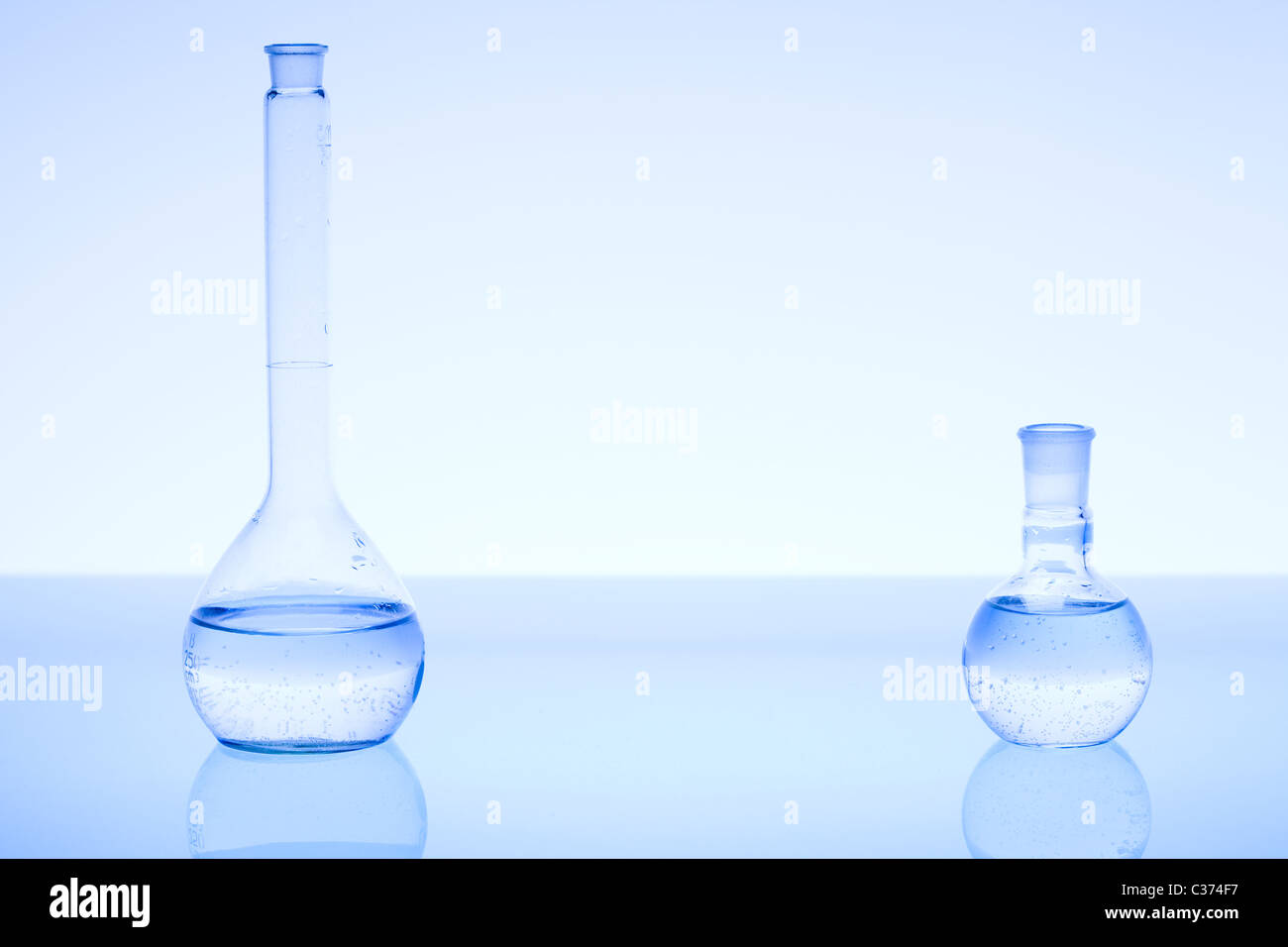 Laboratory glass in blue scenery Stock Photo - Alamy