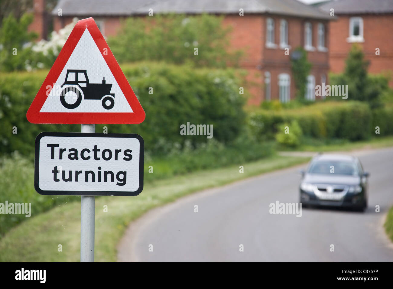 Tractors Turning Road Sign Stock Photo - Alamy