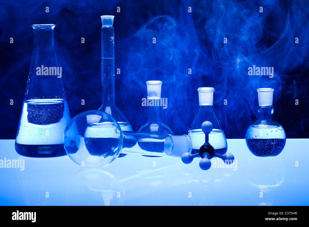 Laboratory glass in blue scenery Stock Photo - Alamy