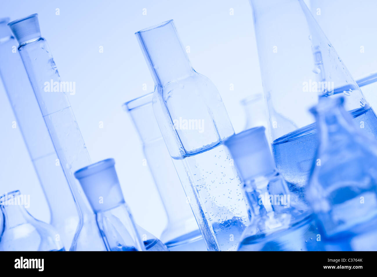 Laboratory glass in blue scenery Stock Photo - Alamy