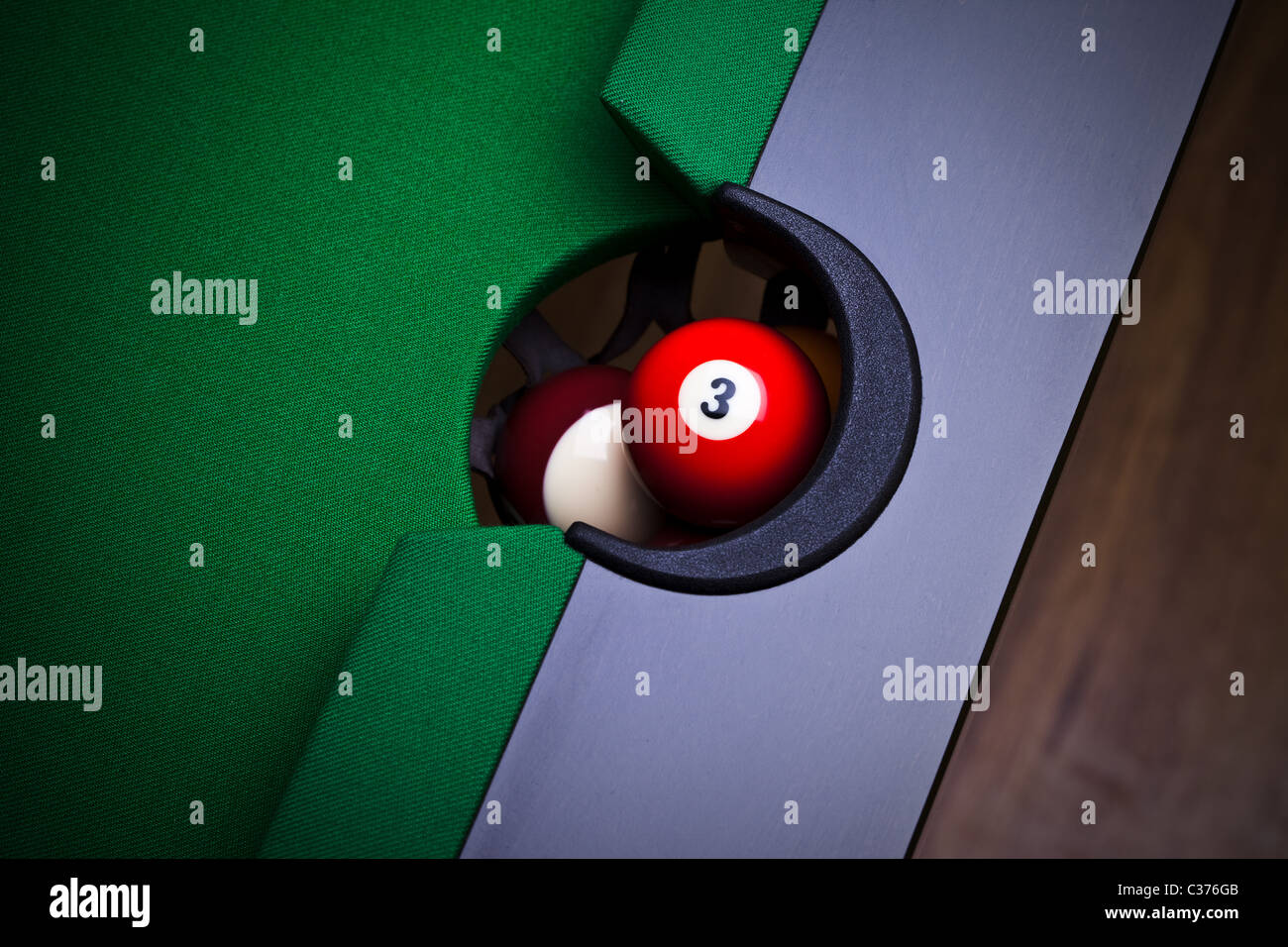Billiard balls over green table Stock Photo - Alamy