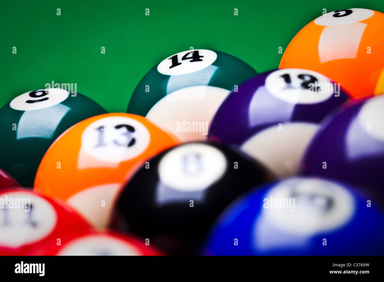 Billiard balls over green table Stock Photo - Alamy