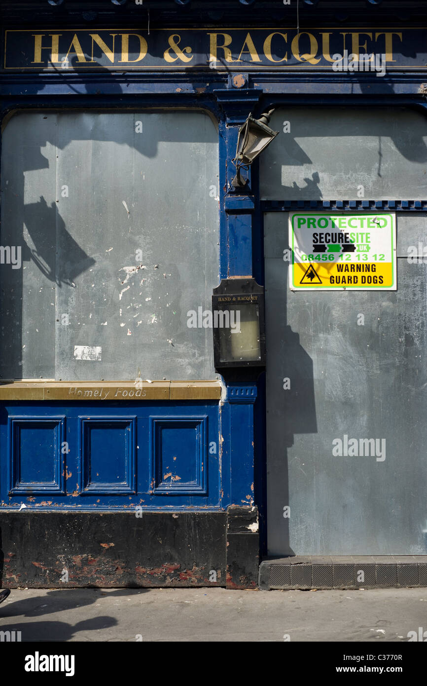 Hand racquet boarded up pub hi-res stock photography and images - Alamy