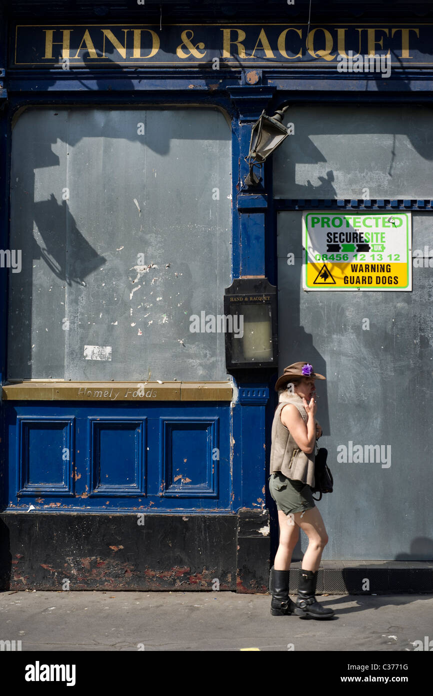 Hand racquet boarded up pub hi-res stock photography and images - Alamy