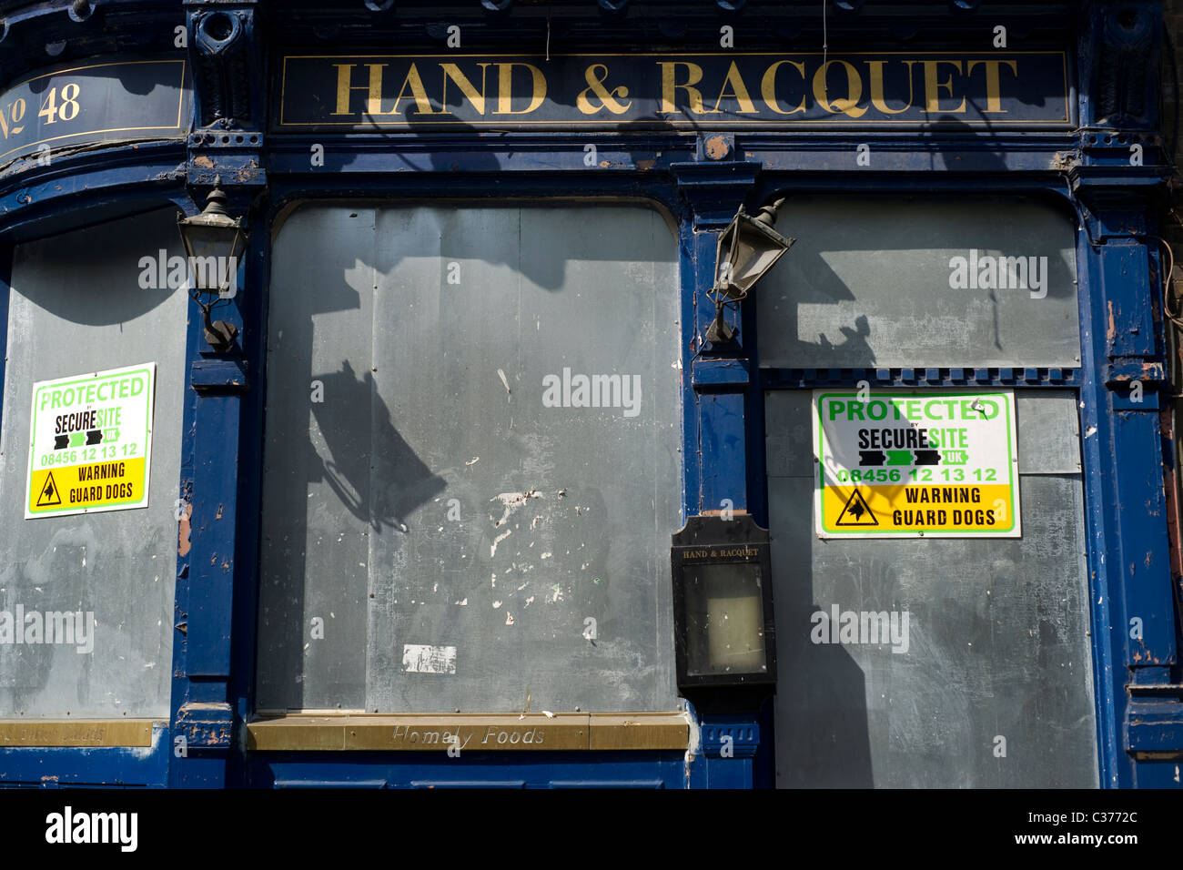 Hand racquet boarded up pub hi-res stock photography and images - Alamy