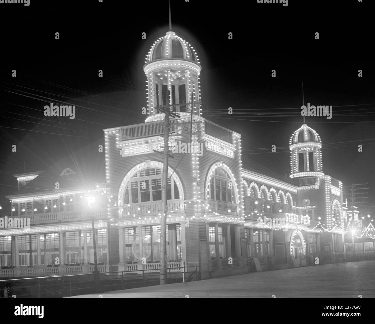 Steel Pier, Atlantic City, NJ Boardwalk at night, circa 1915 Stock ...