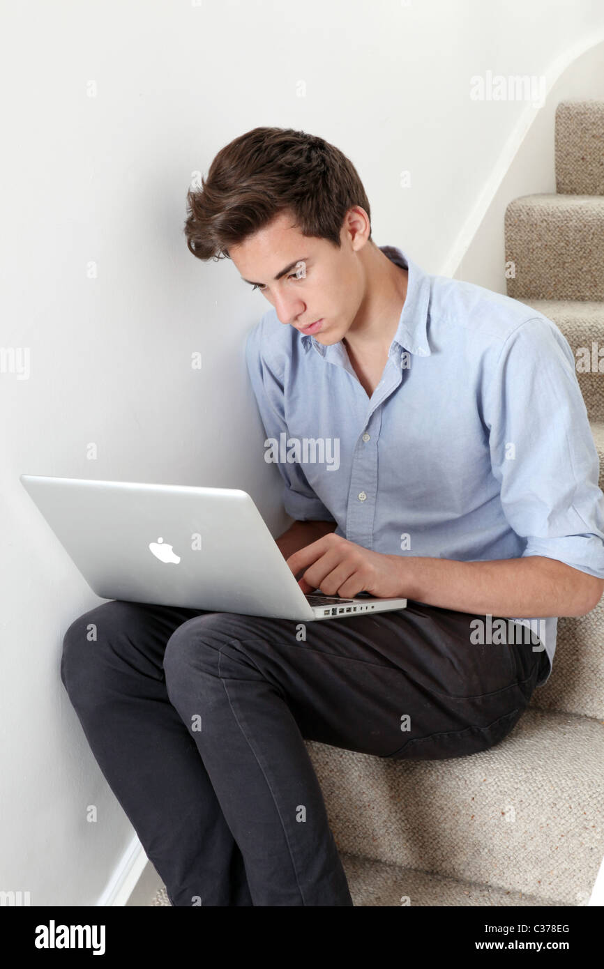 Young boy using apple laptop hi-res stock photography and images - Alamy