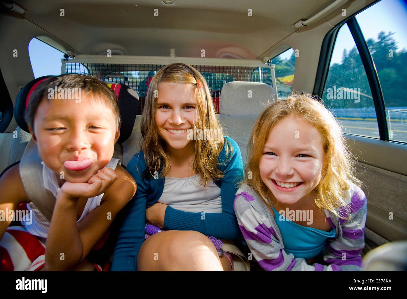 children making faces in car Stock Photo - Alamy
