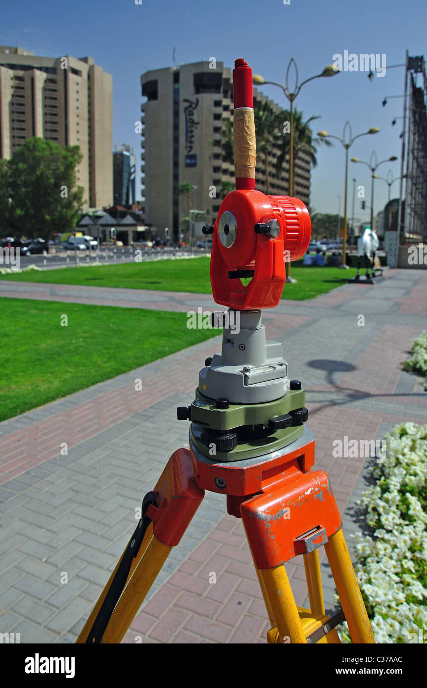 Surveyor's leveling instrument on promenade, Dubai Creek, Deira, Dubai ...